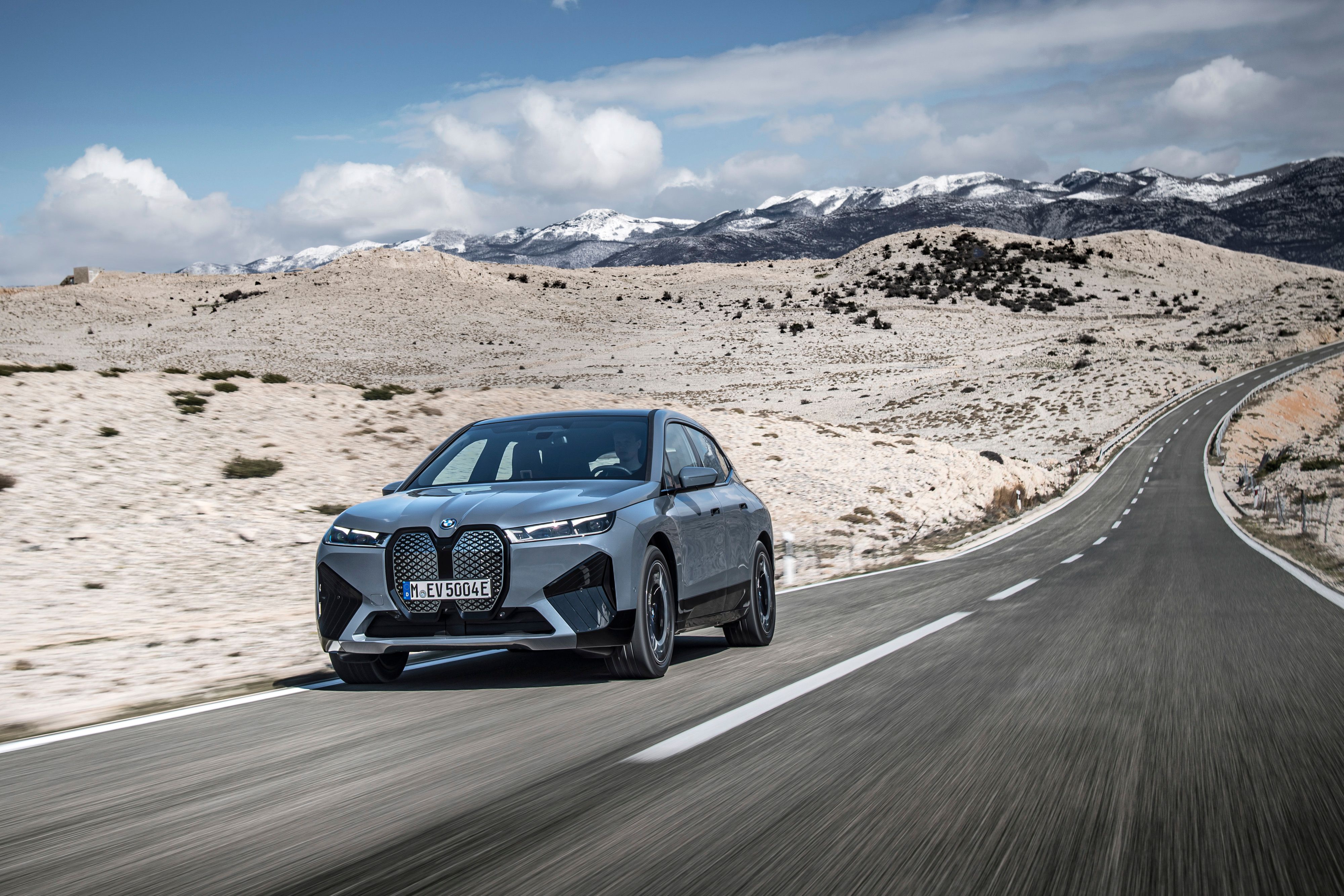 The BMW iX Breaks Cover A Funky Steering Wheel and 300 Miles of Range