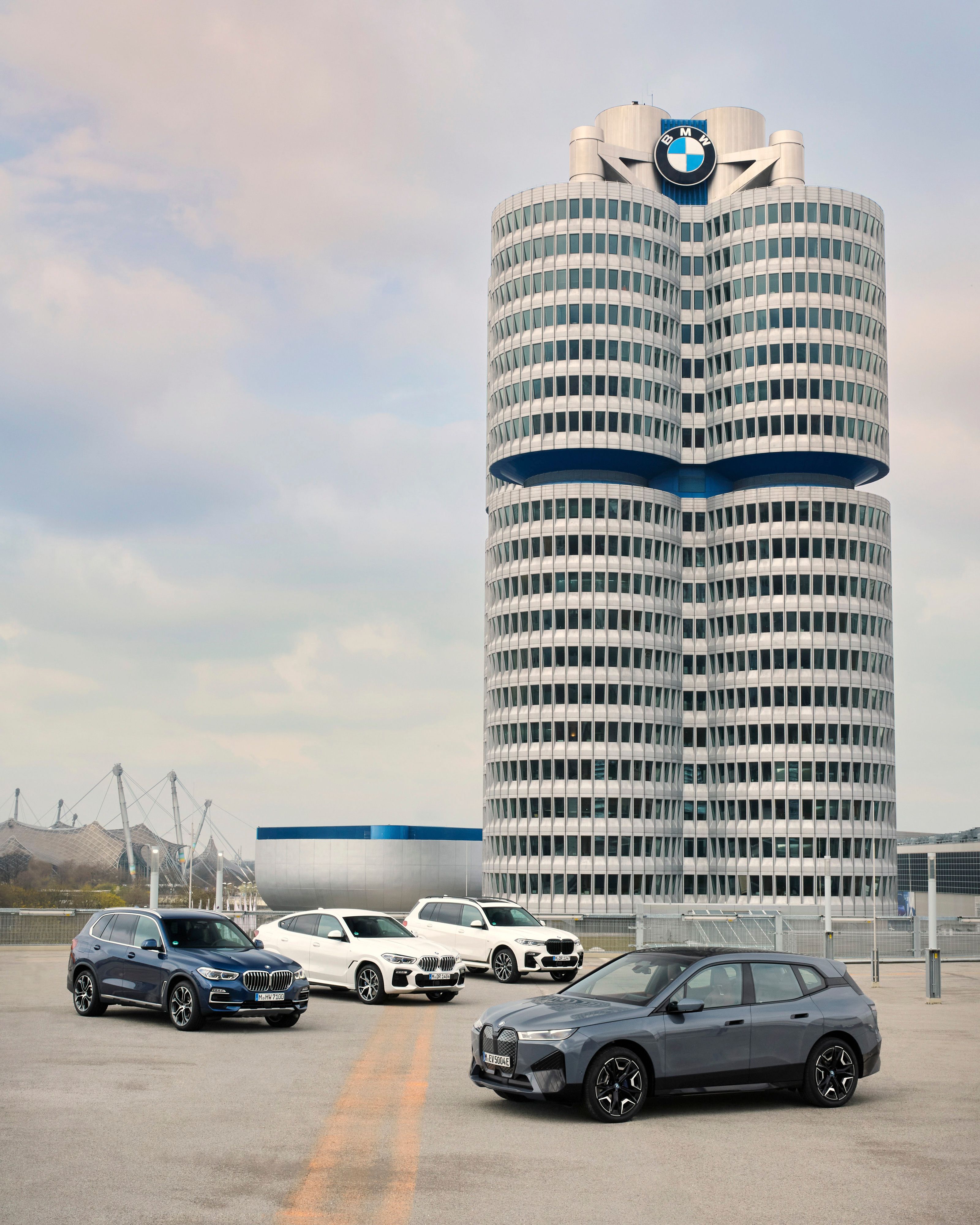 The BMW iX Breaks Cover A Funky Steering Wheel and 300 Miles of Range