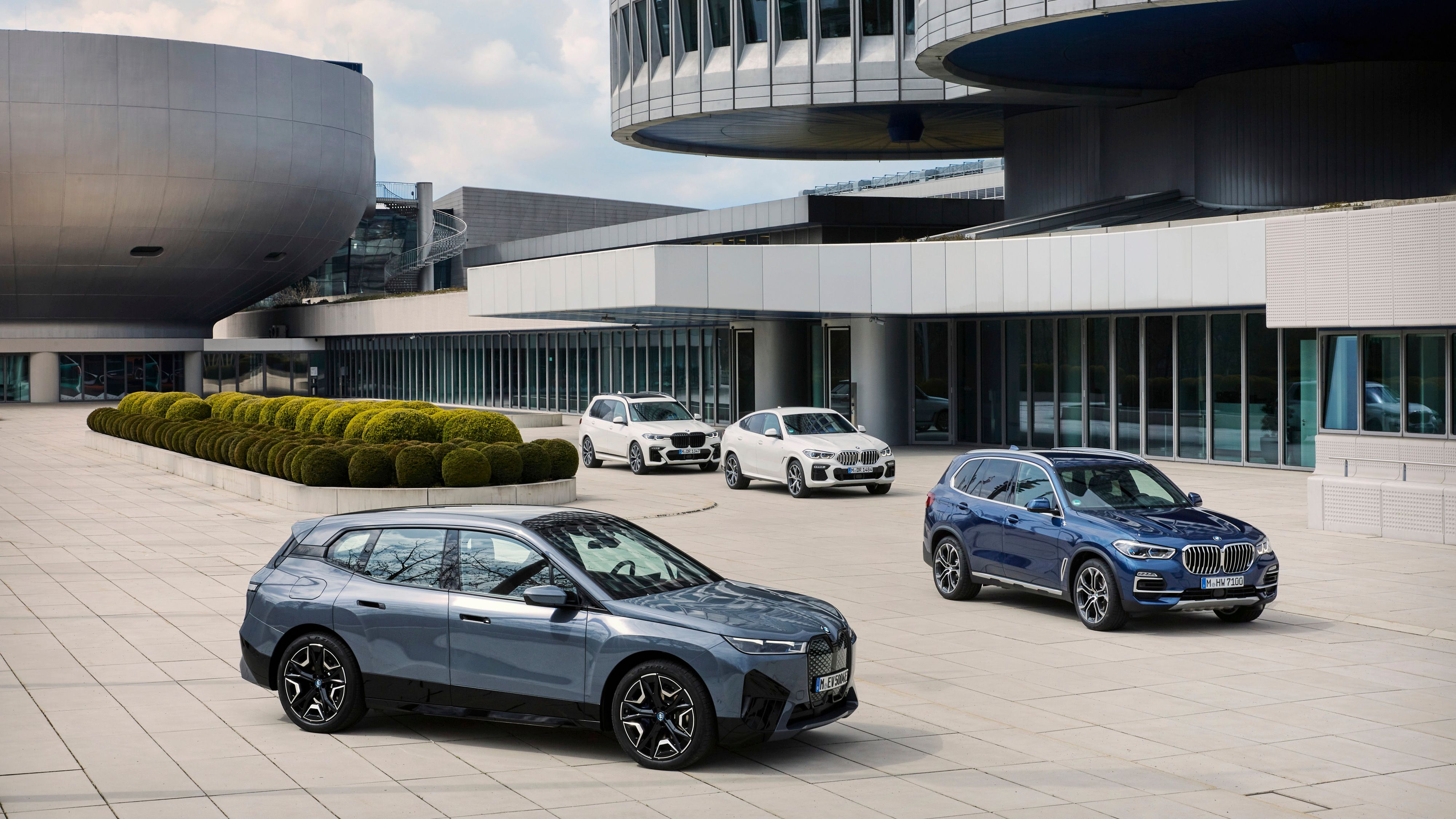 The BMW iX Breaks Cover A Funky Steering Wheel and 300 Miles of Range