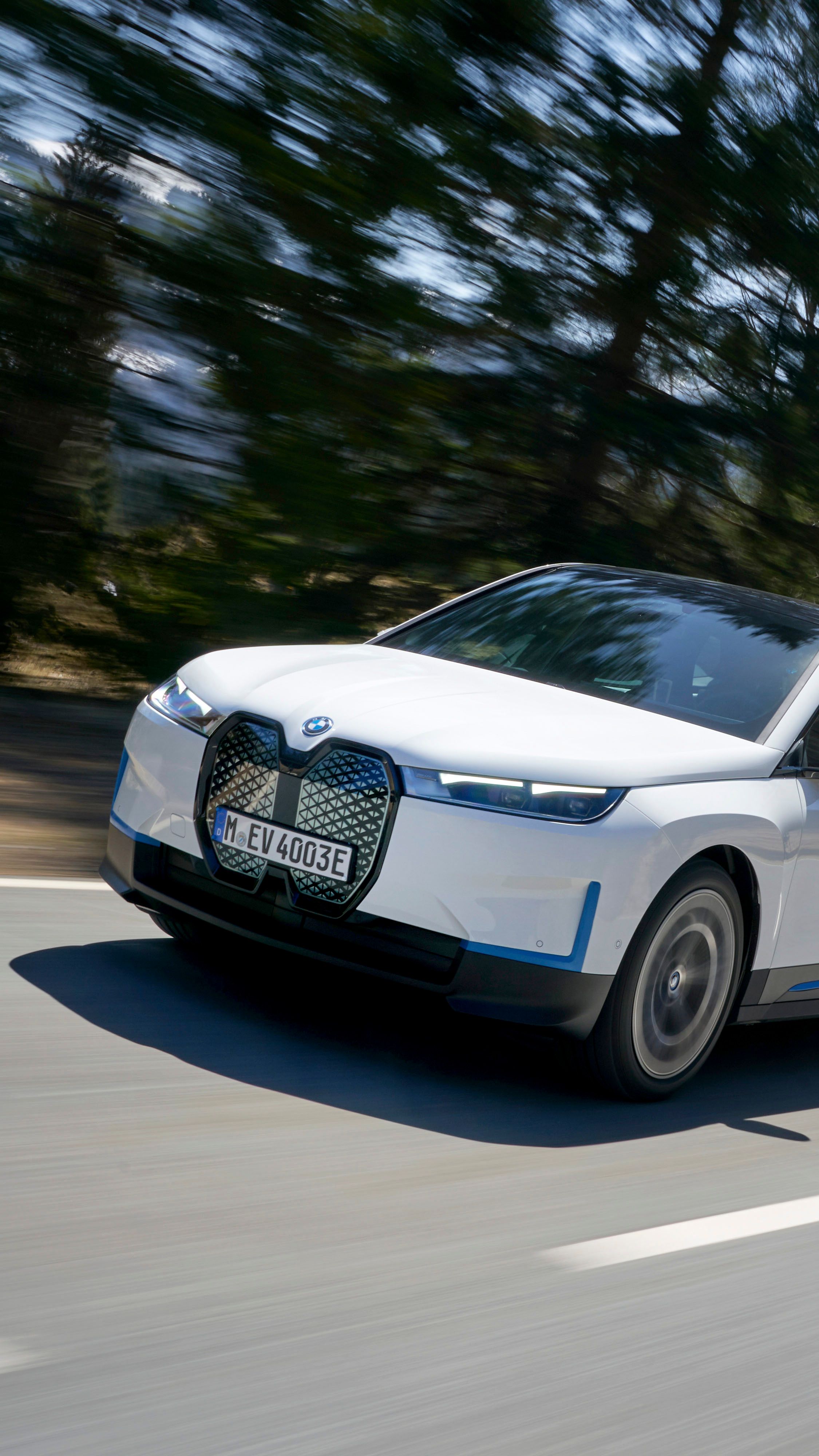 The BMW iX Breaks Cover A Funky Steering Wheel and 300 Miles of Range