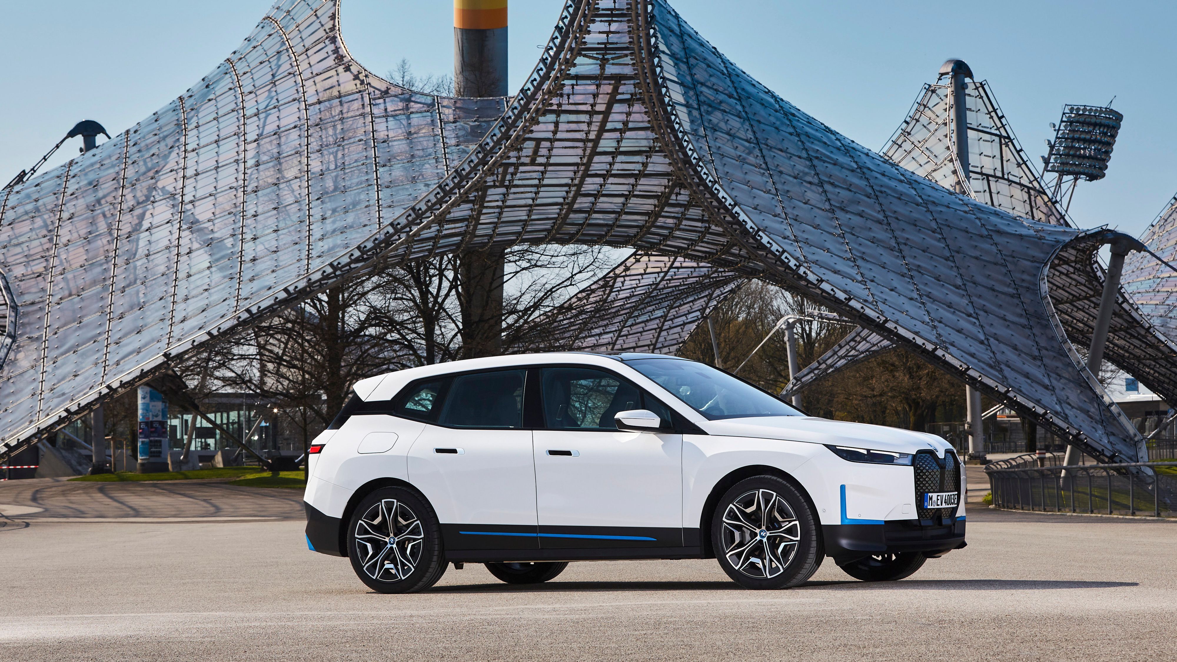 The BMW iX Breaks Cover A Funky Steering Wheel and 300 Miles of Range